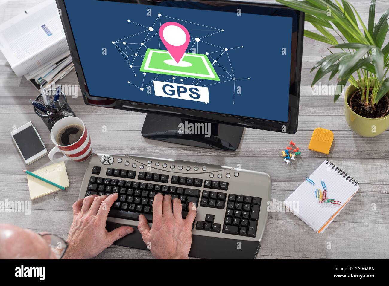 Man using a computer with gps concept on the screen Stock Photo - Alamy