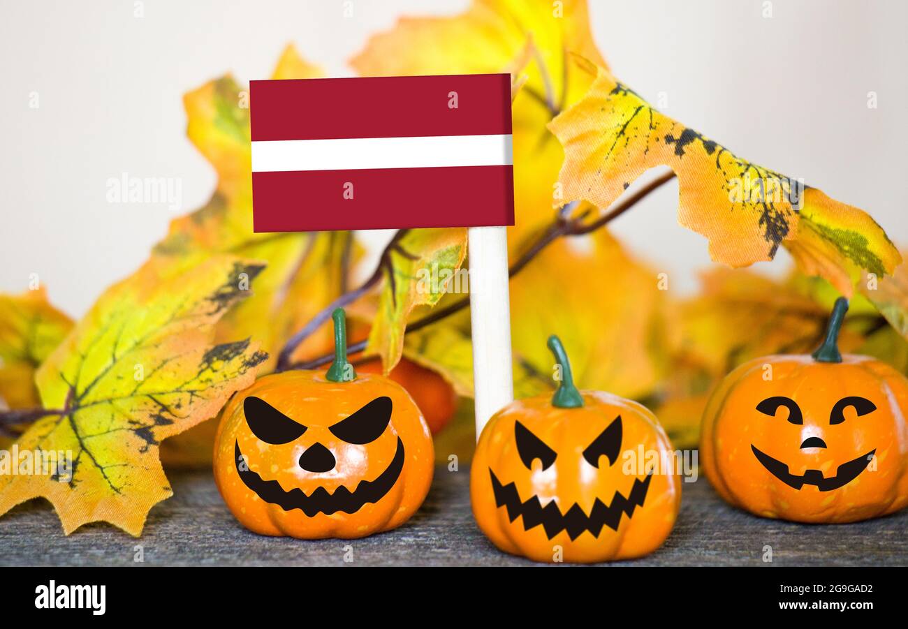 Colorful Halloween background with smiley pumpkins and toy flag of ...