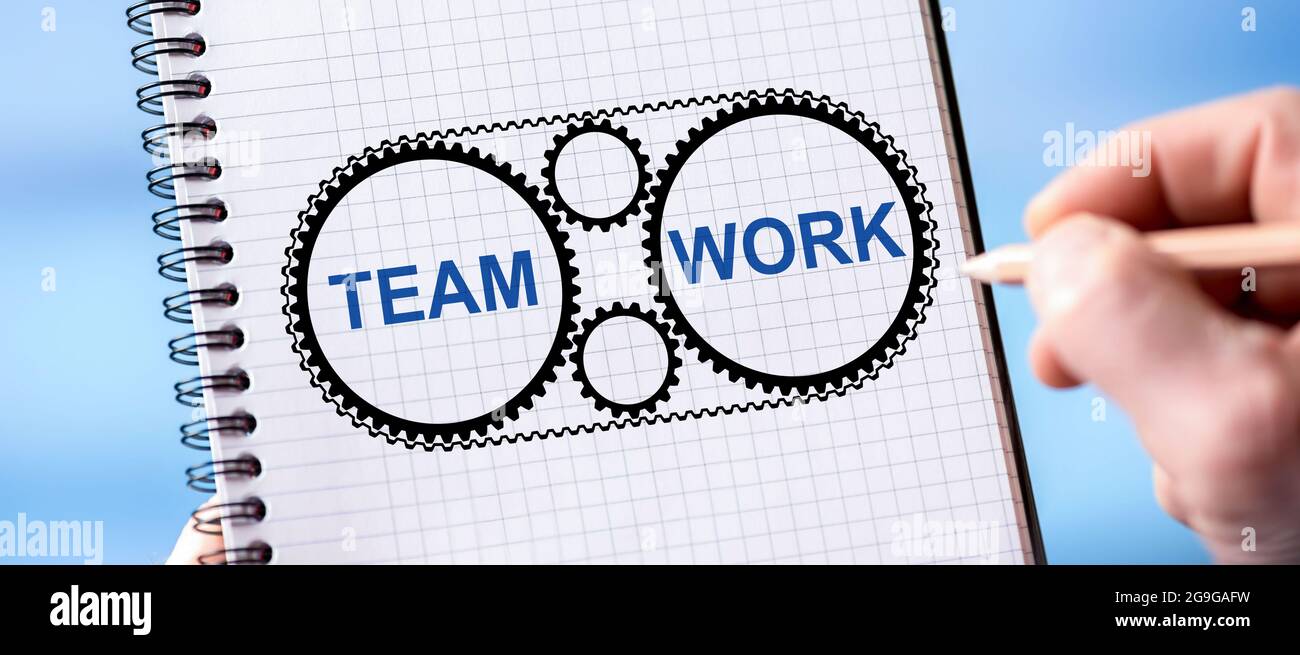 Hand drawing teamwork concept on a notepad Stock Photo - Alamy