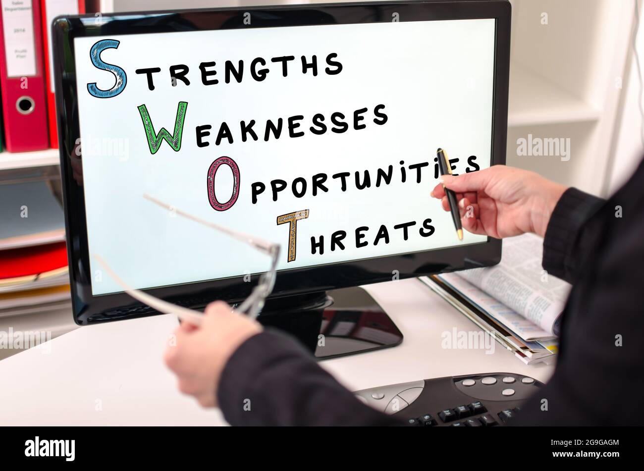 Businesswoman showing swot concept on a computer screen Stock Photo - Alamy