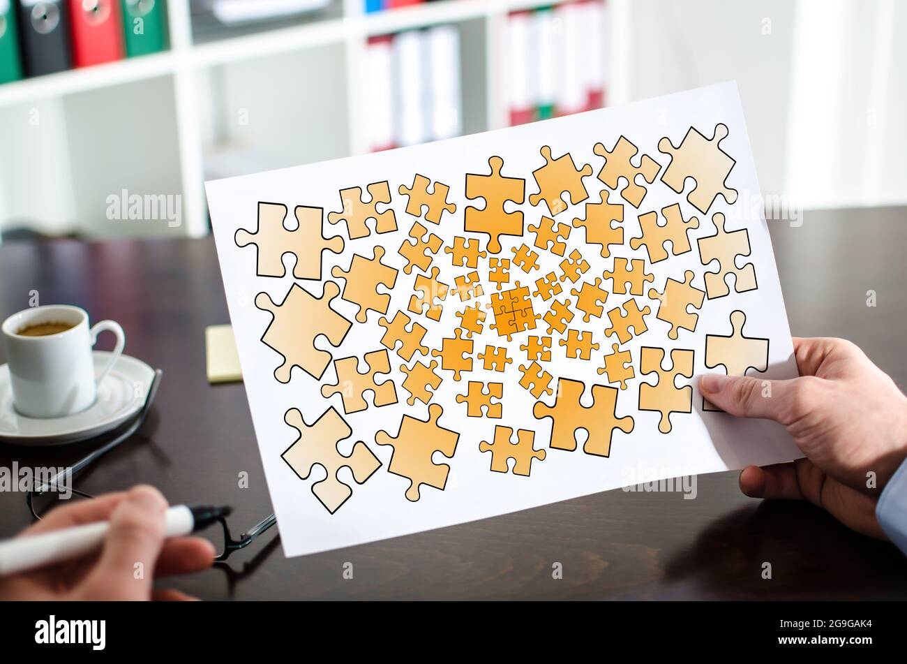 Hand holding a paper showing teamwork concept Stock Photo - Alamy