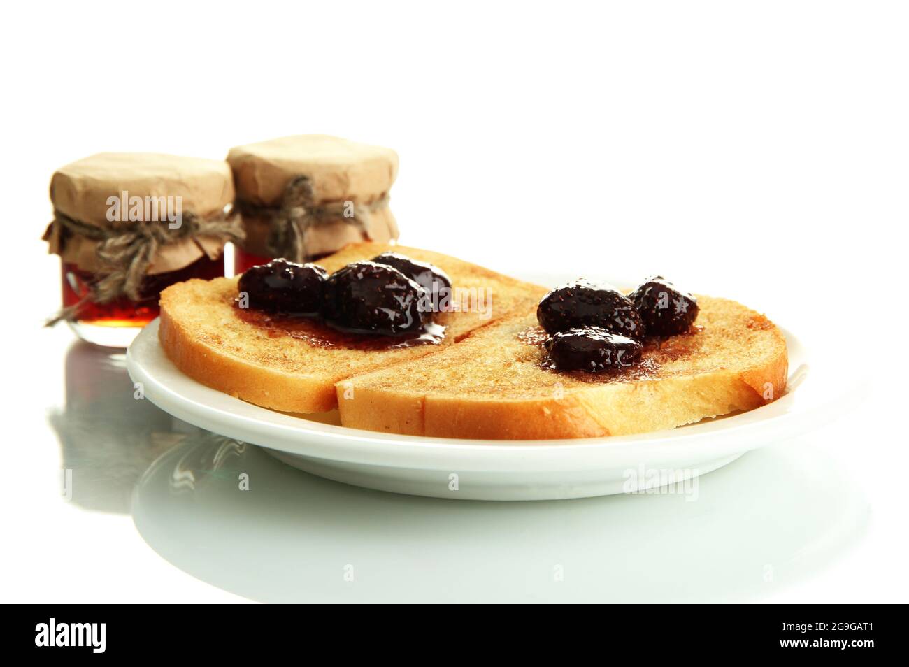 White bread toast with jam on plate, isolated on white Stock Photo - Alamy