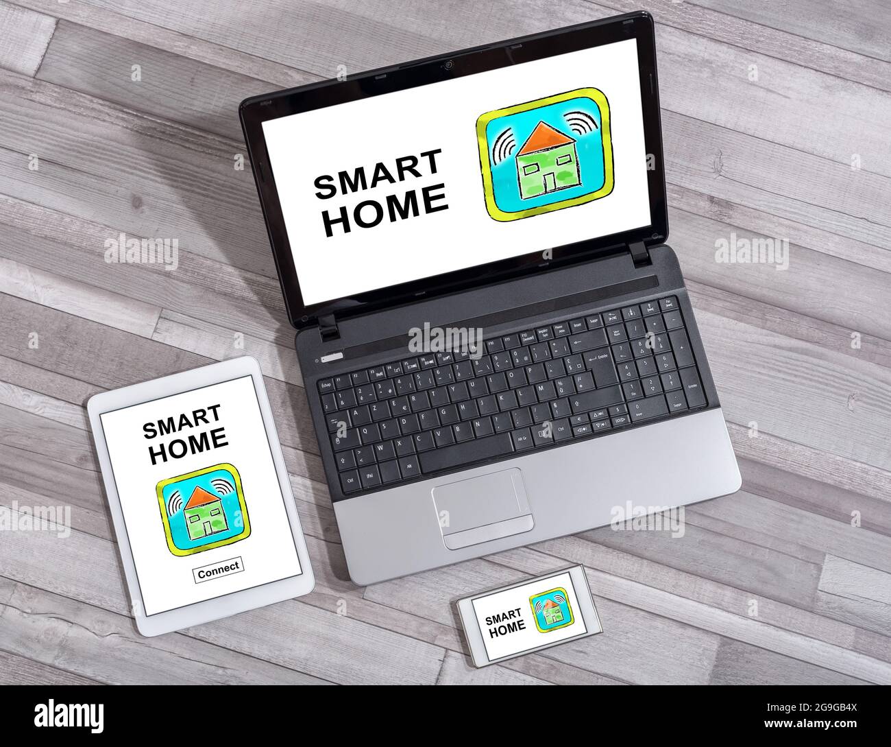 Smart home concept shown on different information technology devices ...