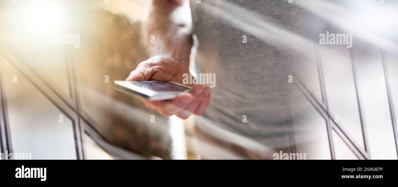 Man standing using his smartphone; multiple exposure Stock Photo - Alamy