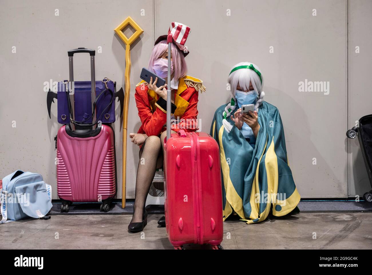 Visitors and participant dressed-up cosplayers are seen during the Ani ...
