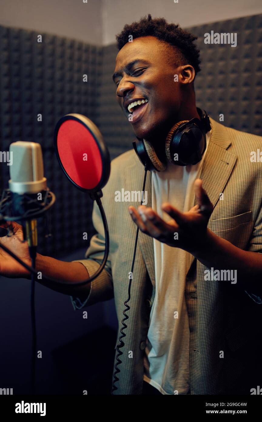 Male singer sings a song, recording studio Stock Photo - Alamy