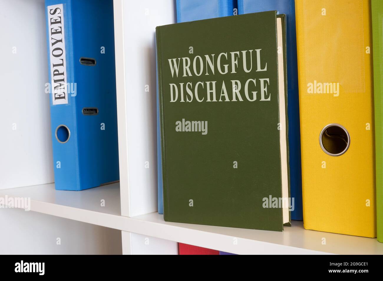 White shelf with book about wrongful discharge Stock Photo - Alamy