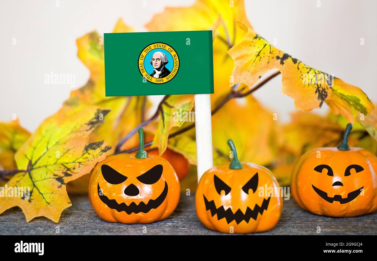 Colorful Halloween background with smiley pumpkins and toy flag of ...