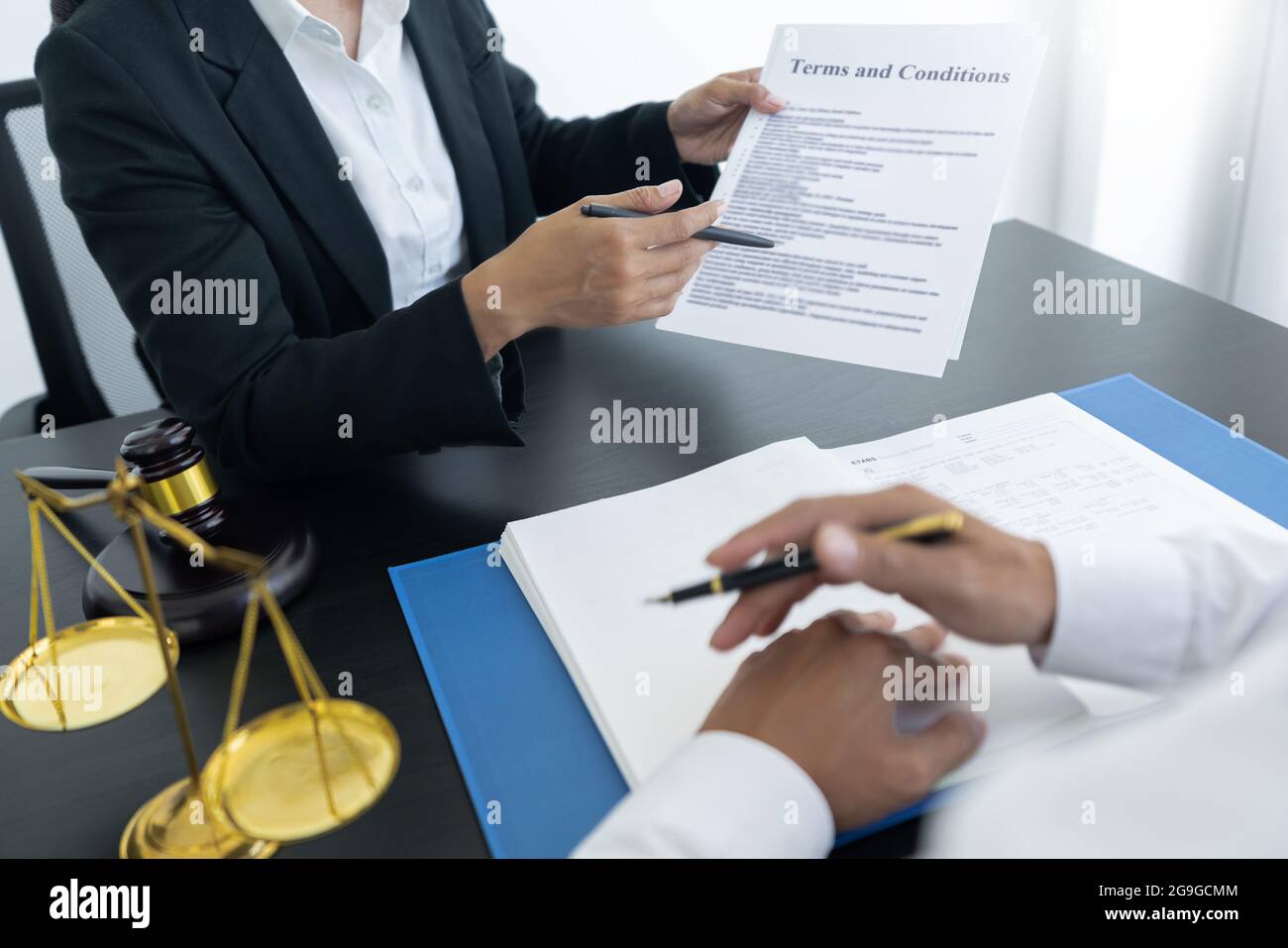 a lawyer checking the correctness in contract used in real estate ...