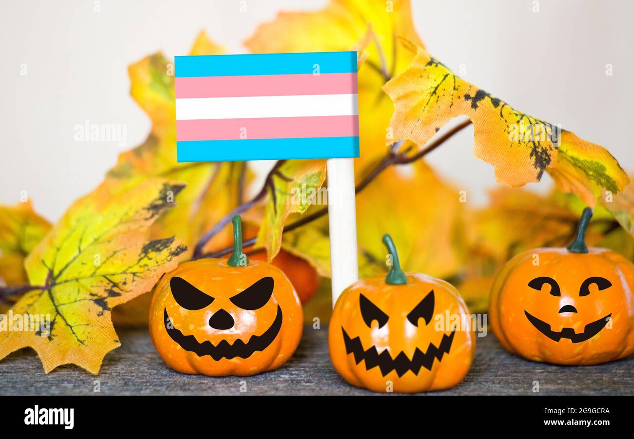 Colorful Halloween background with smiley pumpkins and toy flag of ...