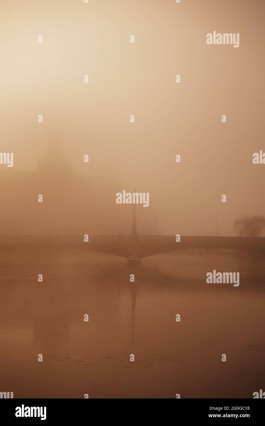 Mist over river with bridge Stock Photo - Alamy