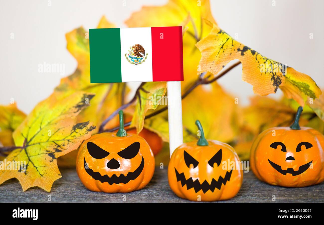 Colorful Halloween background with smiley pumpkins and toy flag of ...