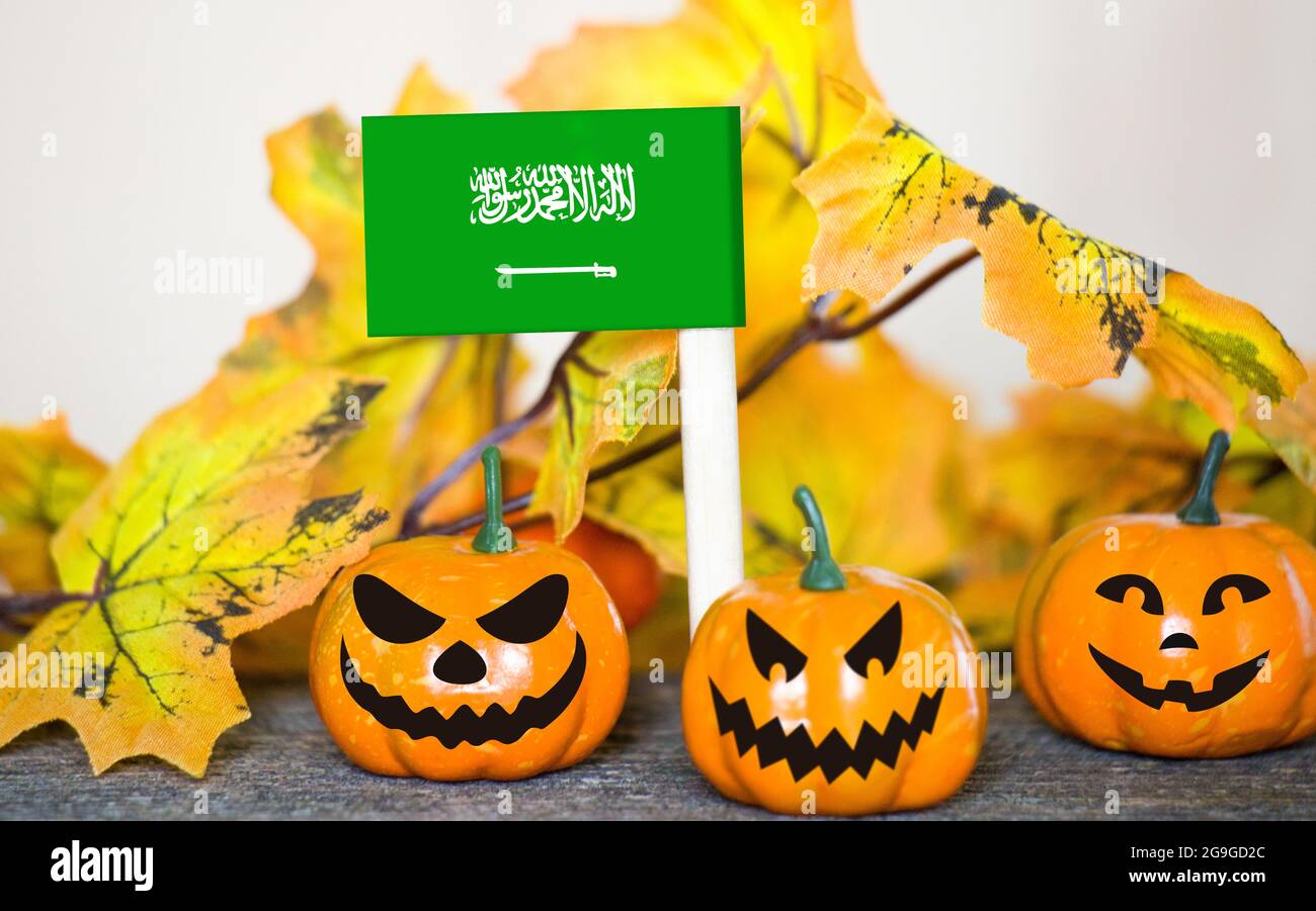 Colorful Halloween background with smiley pumpkins and toy flag of ...