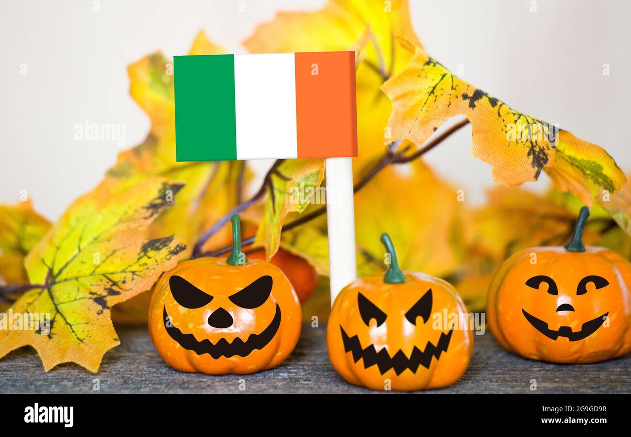 Colorful Halloween background with smiley pumpkins and toy flag of ...