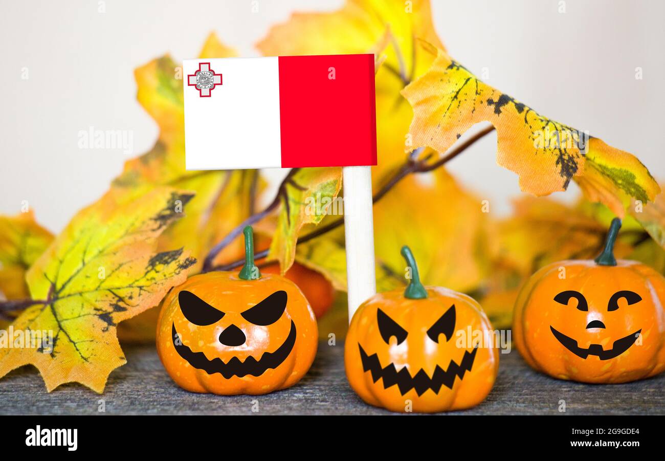 Colorful Halloween background with smiley pumpkins and toy flag of ...