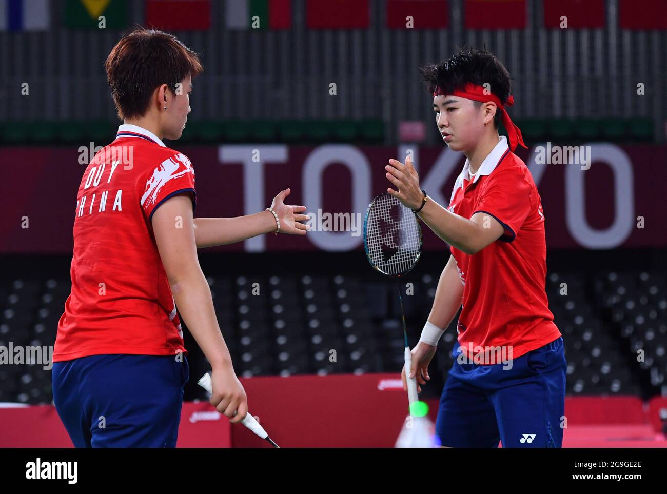 Tokyo, Japan. 26th July, 2021. Du Yue/Li Yinhui (R) of China react ...