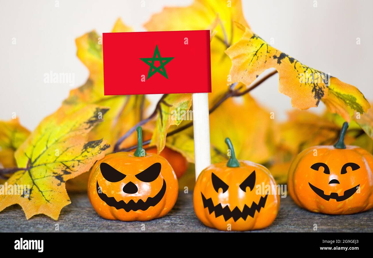 Colorful Halloween background with smiley pumpkins and toy flag of ...