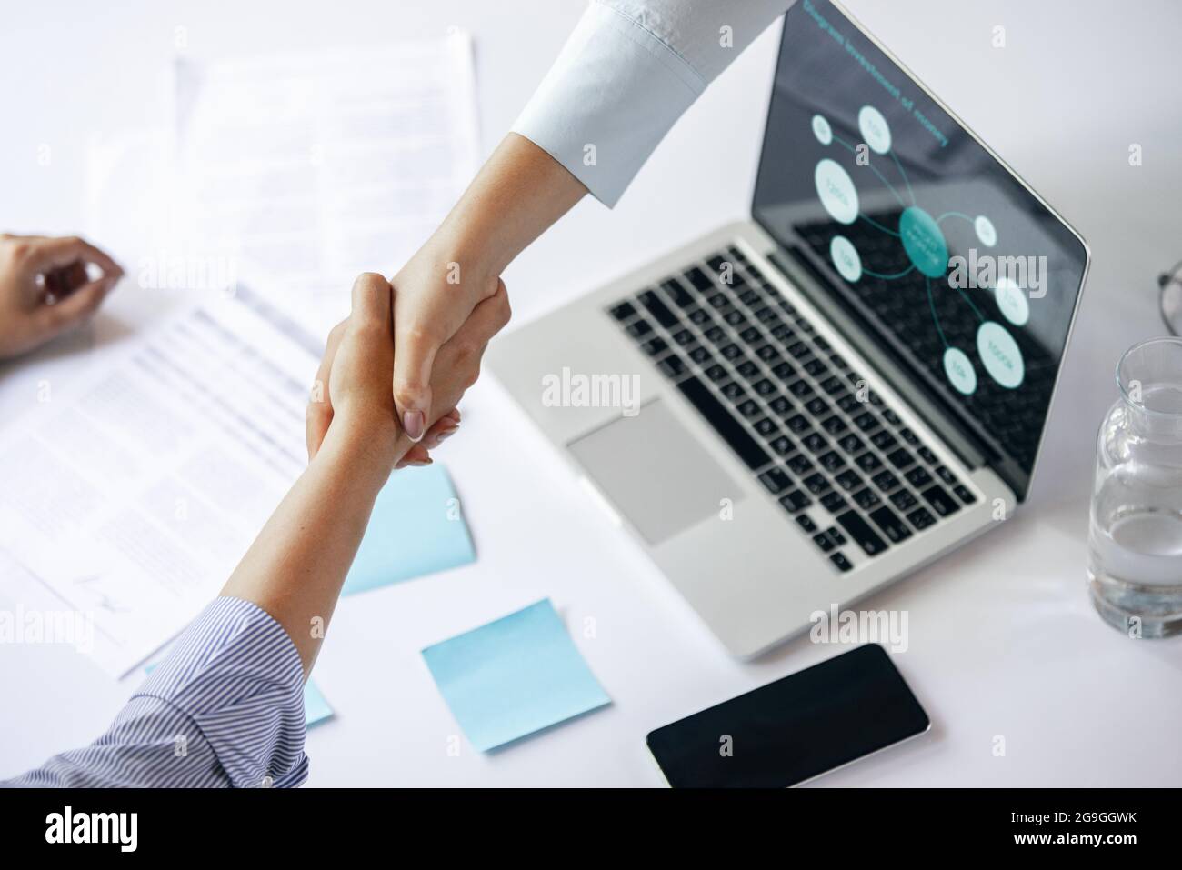 Two young women, colleguas during working day, business meeting ...
