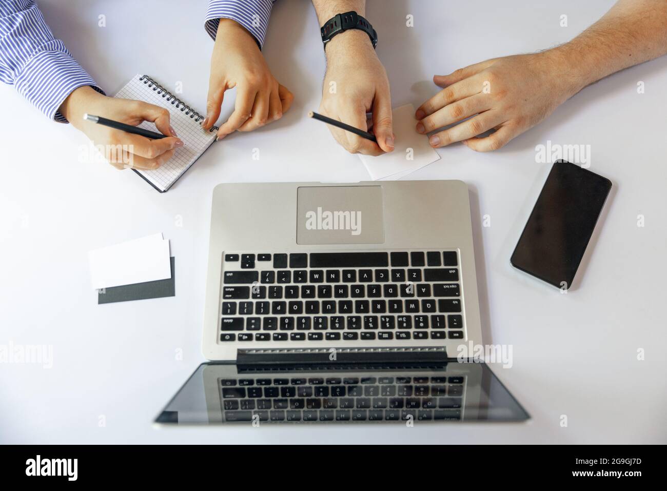 Close-up male and female hands during working day, business meeting ...