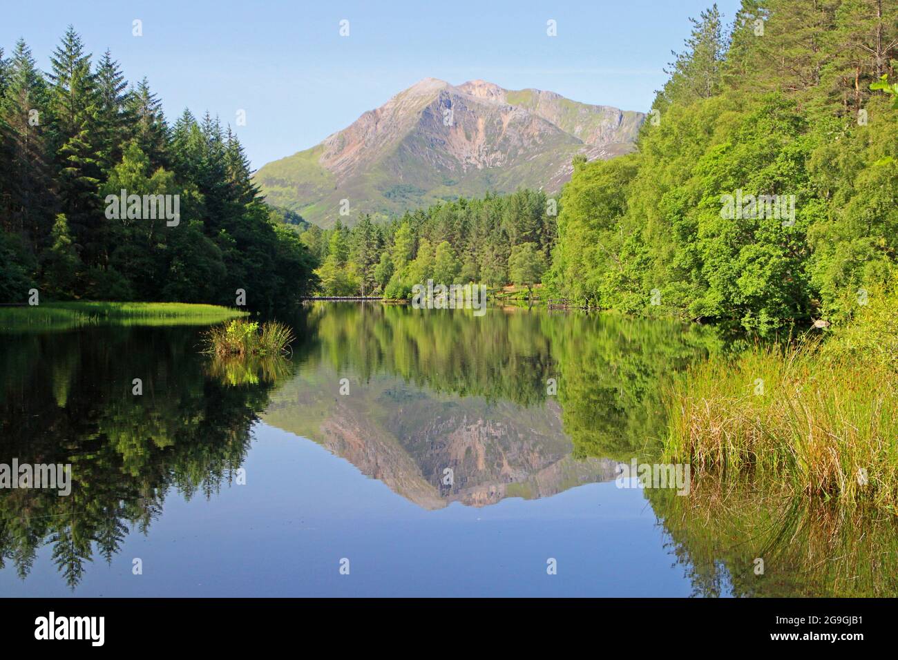 Meall Mor reflections in Glencoe Lochan, Highlands, Scotland Stock ...