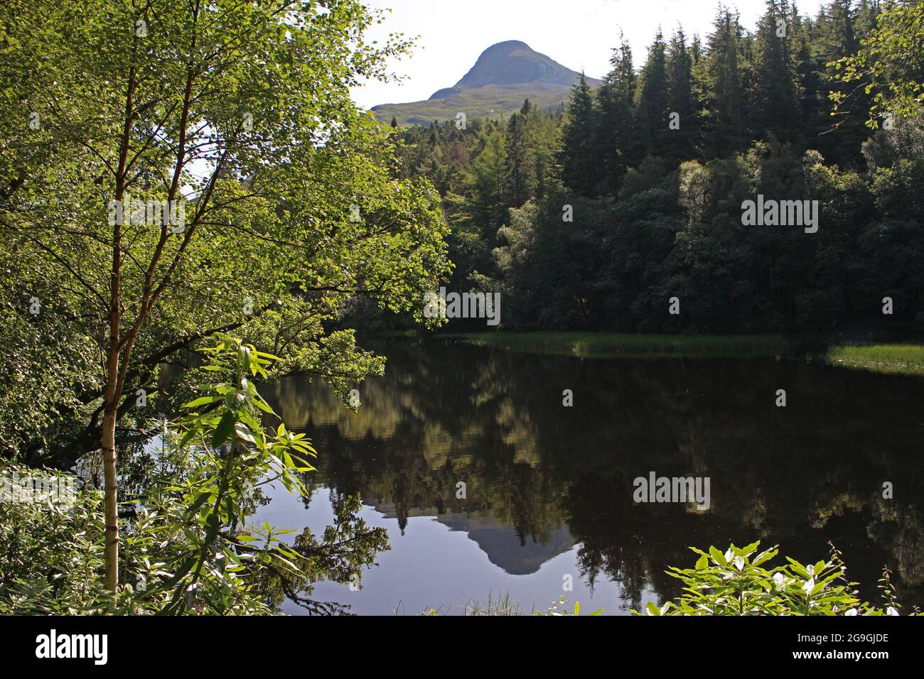 Pap of Glencoe reflections in Glencoe Lochan, Highlands, Scotland Stock Photo - Alamy