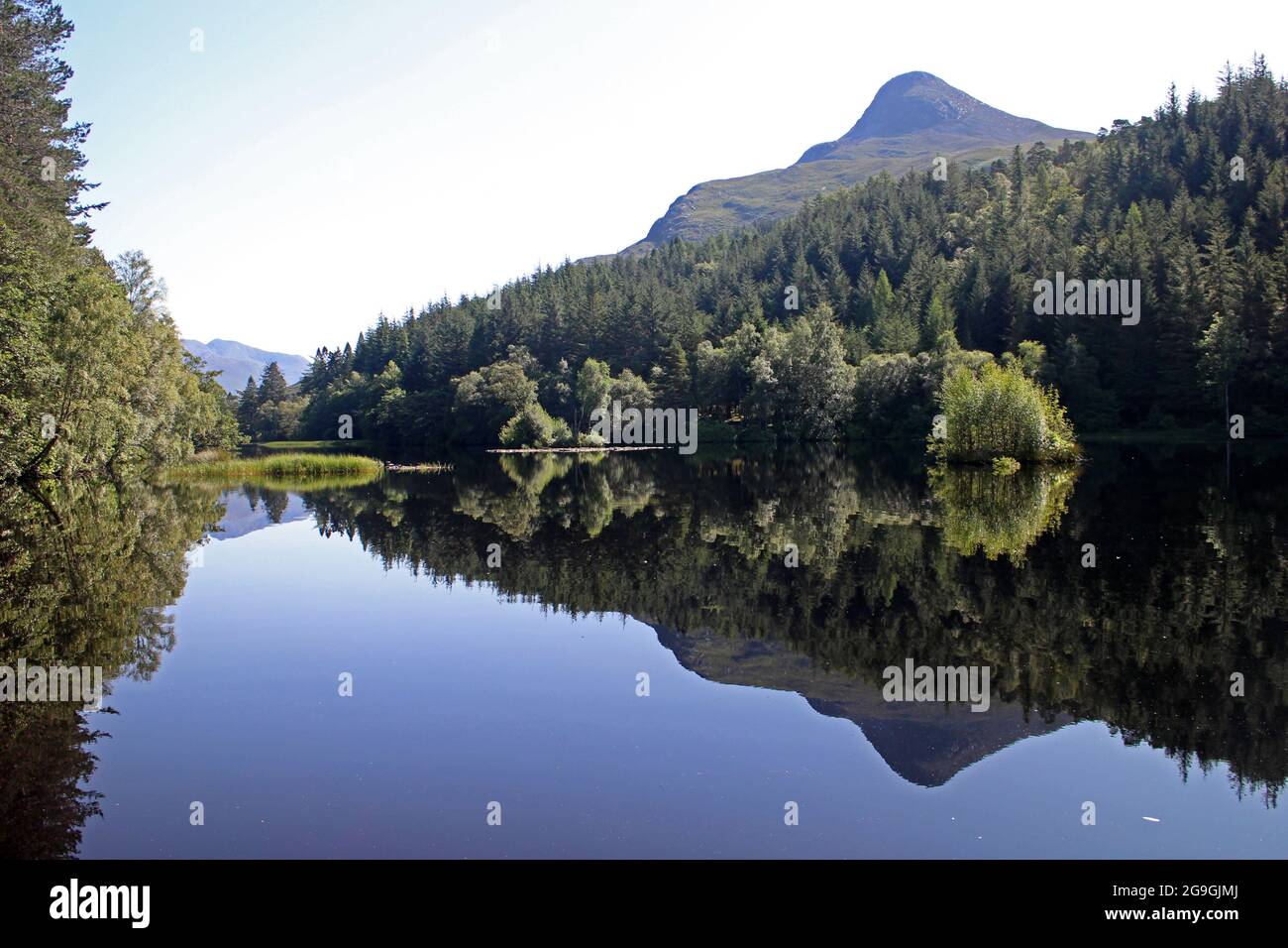 Pap of Glencoe reflections in Glencoe Lochan, Highlands, Scotland Stock Photo - Alamy