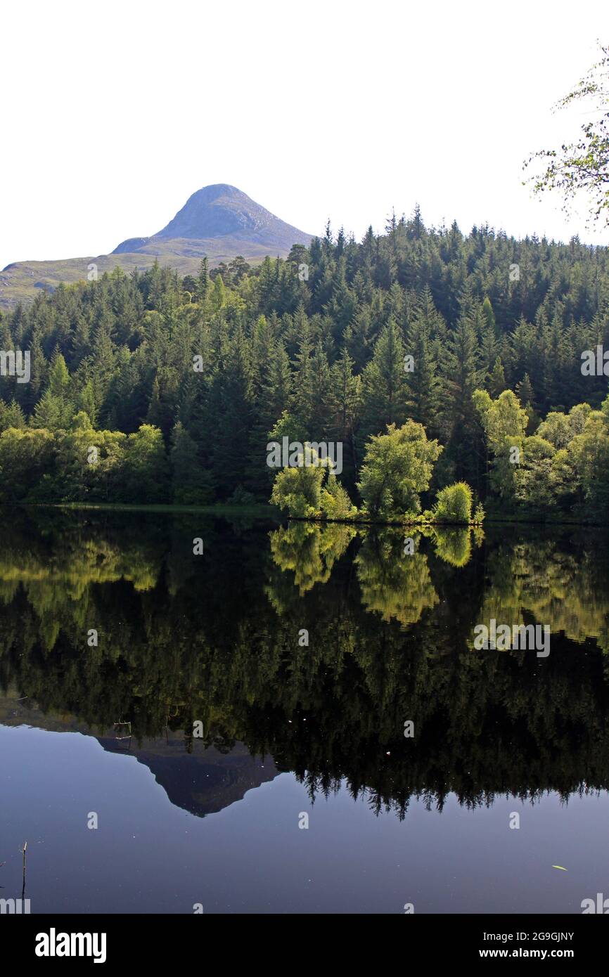 Pap of Glencoe reflections in Glencoe Lochan, Highlands, Scotland Stock Photo - Alamy