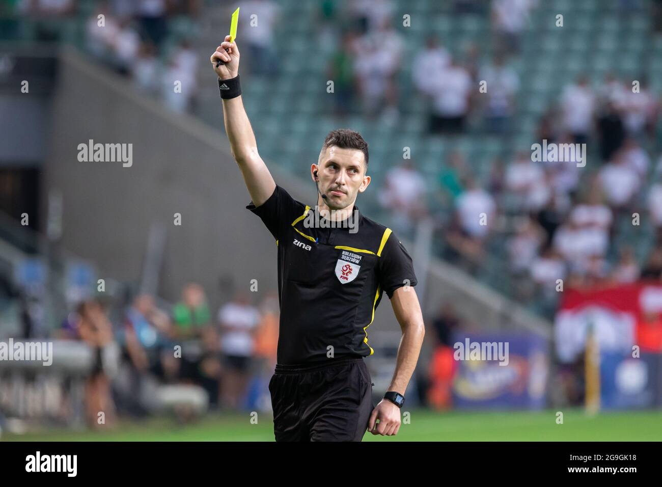 Referee Damian Kos shows a yellow card during the Polish PKO ...