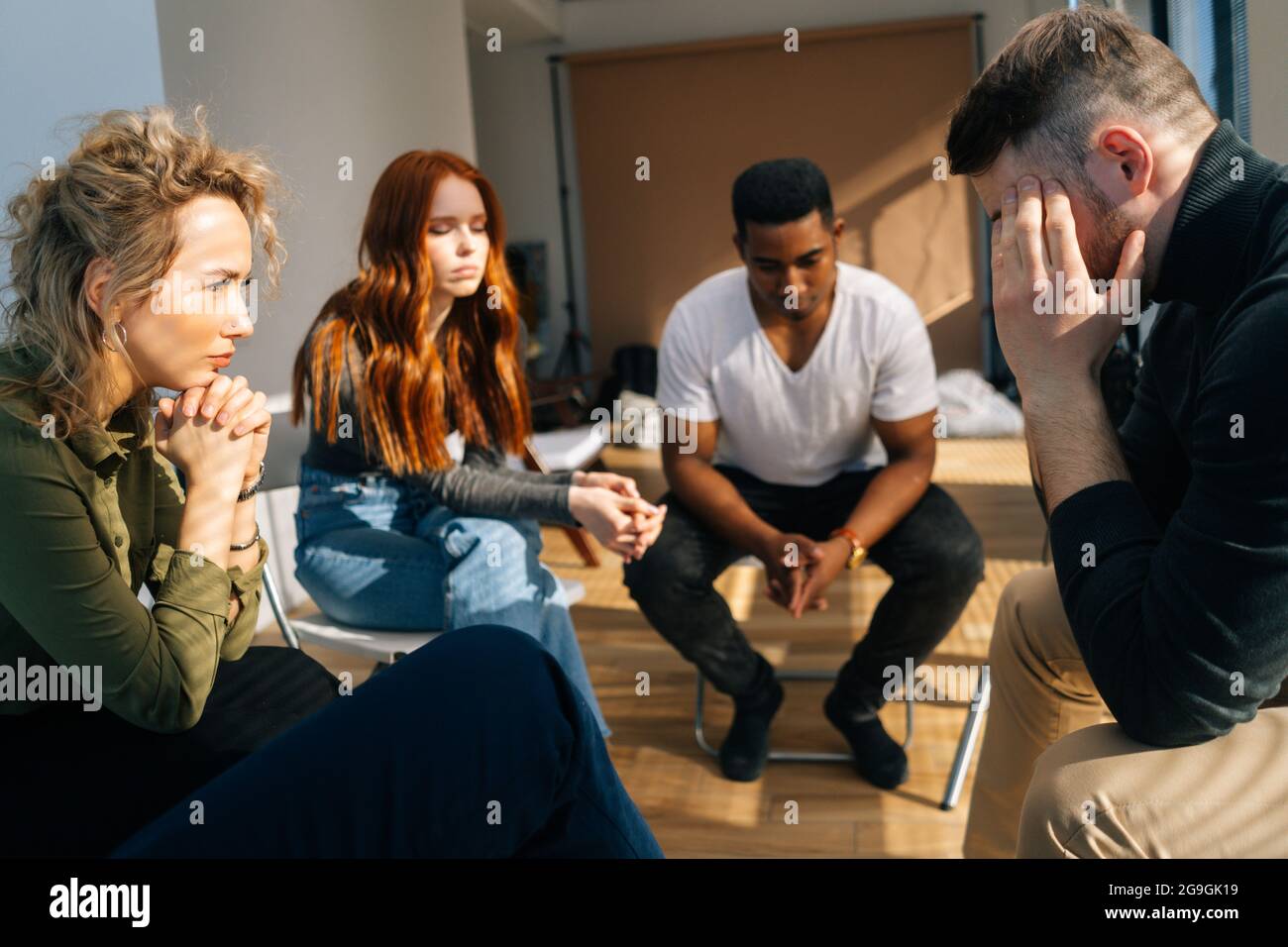 Close-up side view of sad depressed young man talking about problems on ...