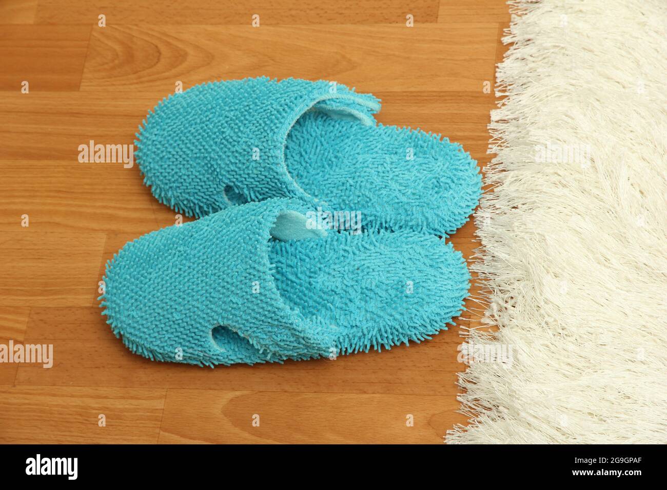 bright slippers, on floor background Stock Photo - Alamy