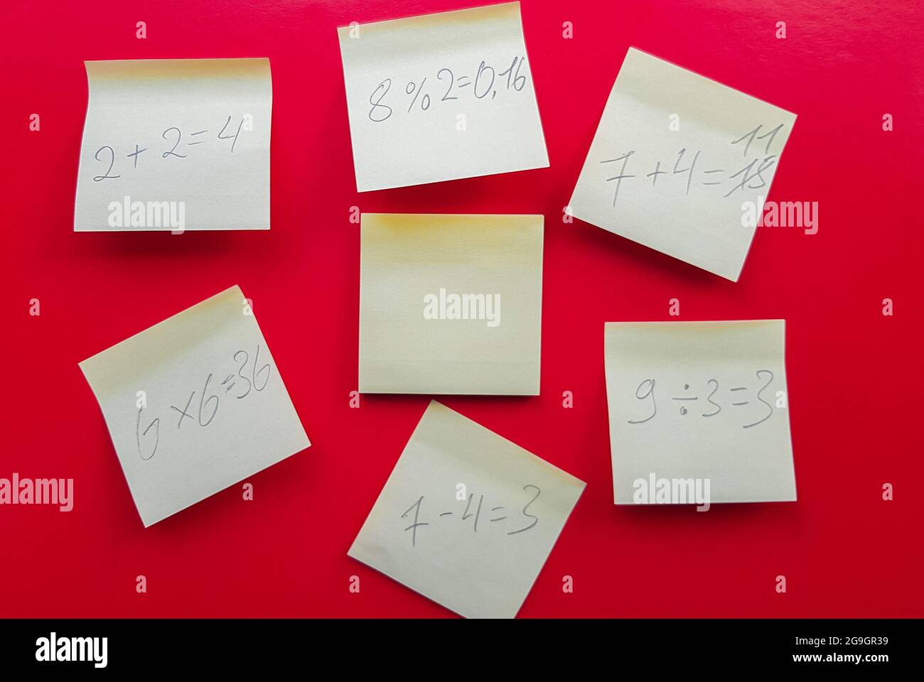 Blank yellow sticky notes with mathematical equations and solving them ...