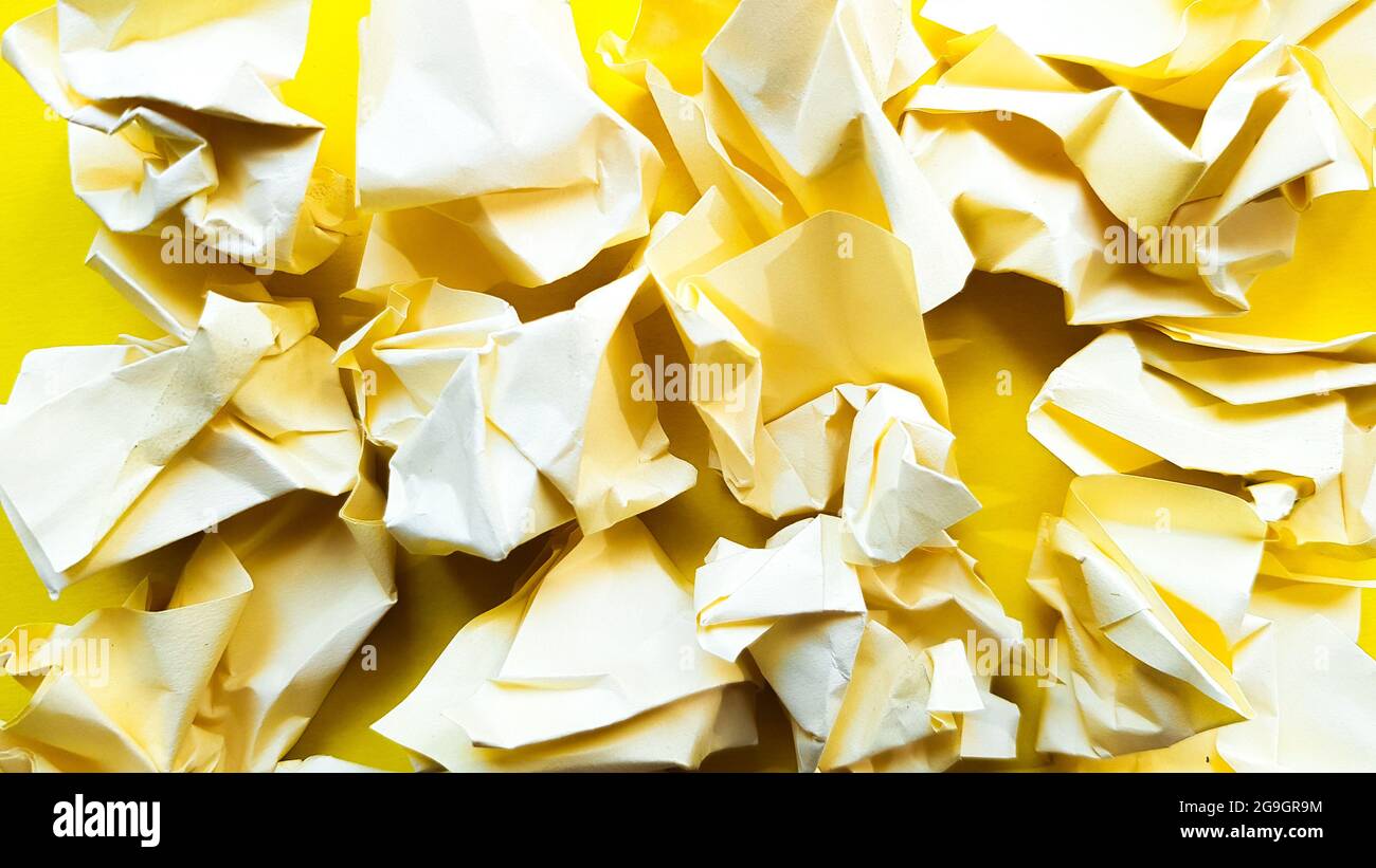 Ball crumpled paper ball isolated on a yellow background. Crumpled ...