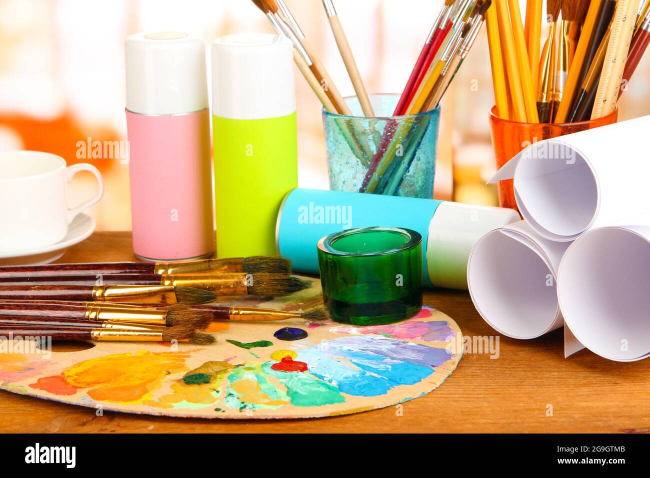 Artistic equipment: paint, brushes and art palette Stock Photo - Alamy