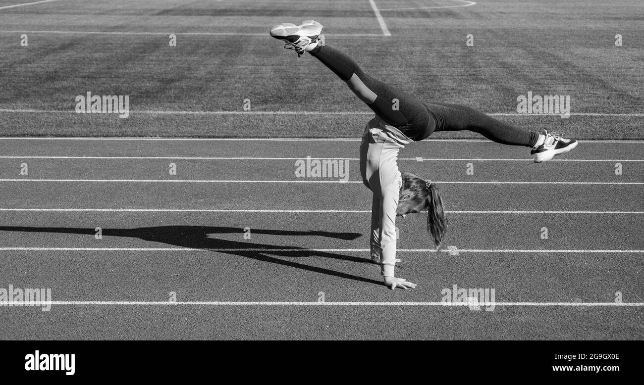 workout on fresh air. confident gymnast with flexible body. gymnastics ...