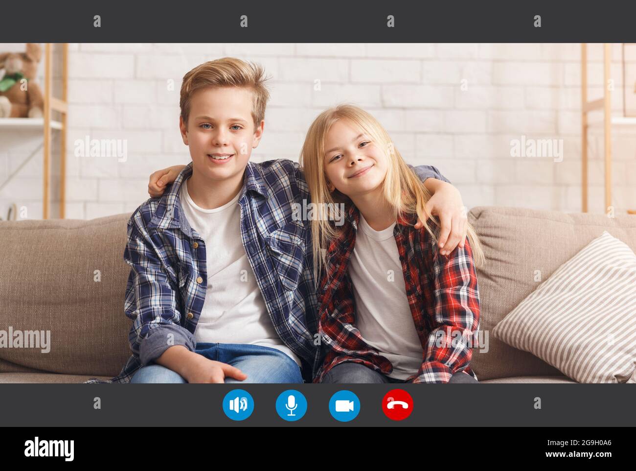 Cute Little Brother And Sister Making Video Call At Home While Relaxing ...