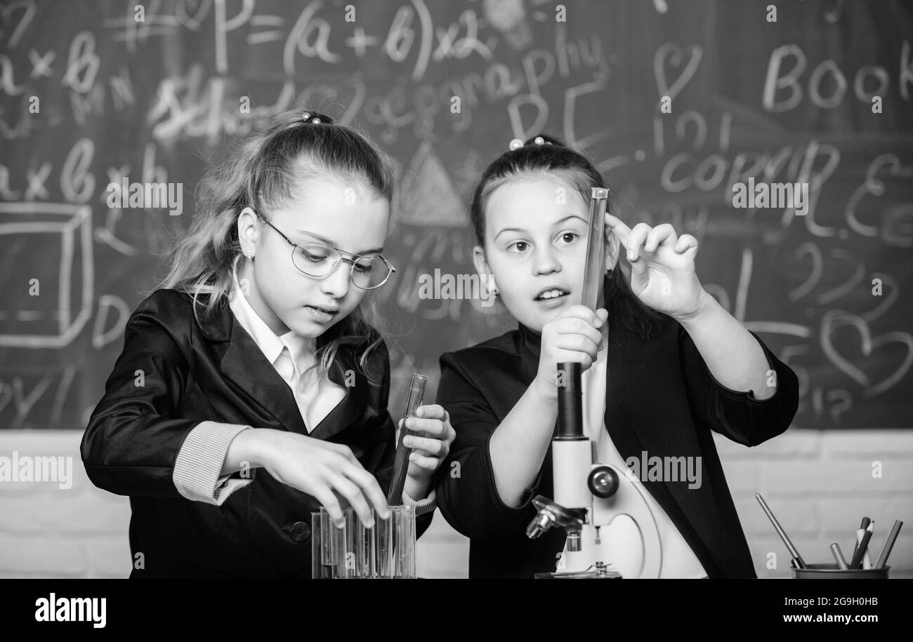 Biology lesson. Back to school. Little scientist work with microscope ...