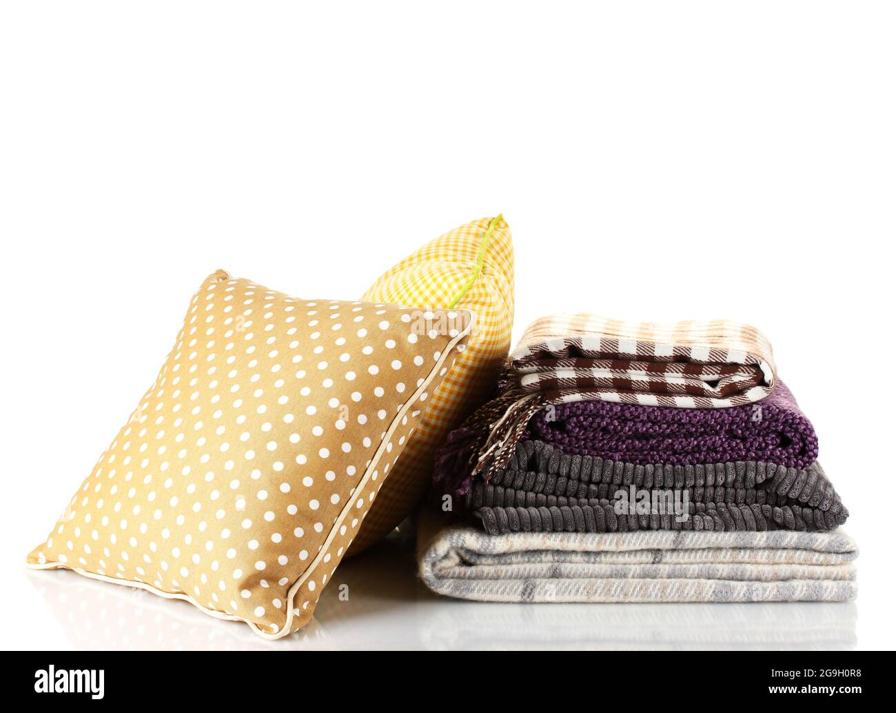 Plaids and color pillows, isolated on white Stock Photo - Alamy