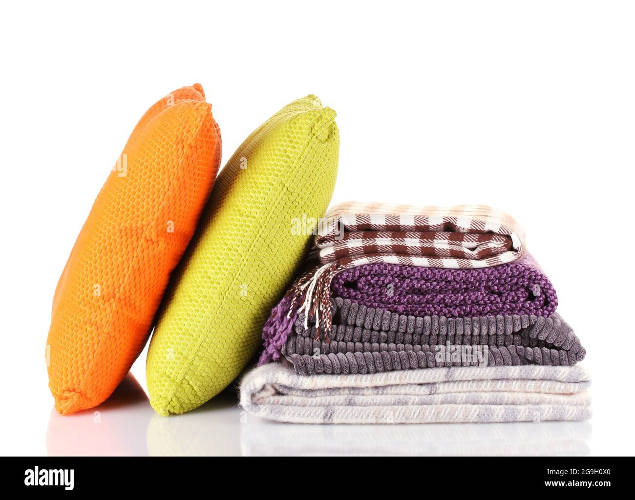 Plaids and color pillows, isolated on white Stock Photo - Alamy