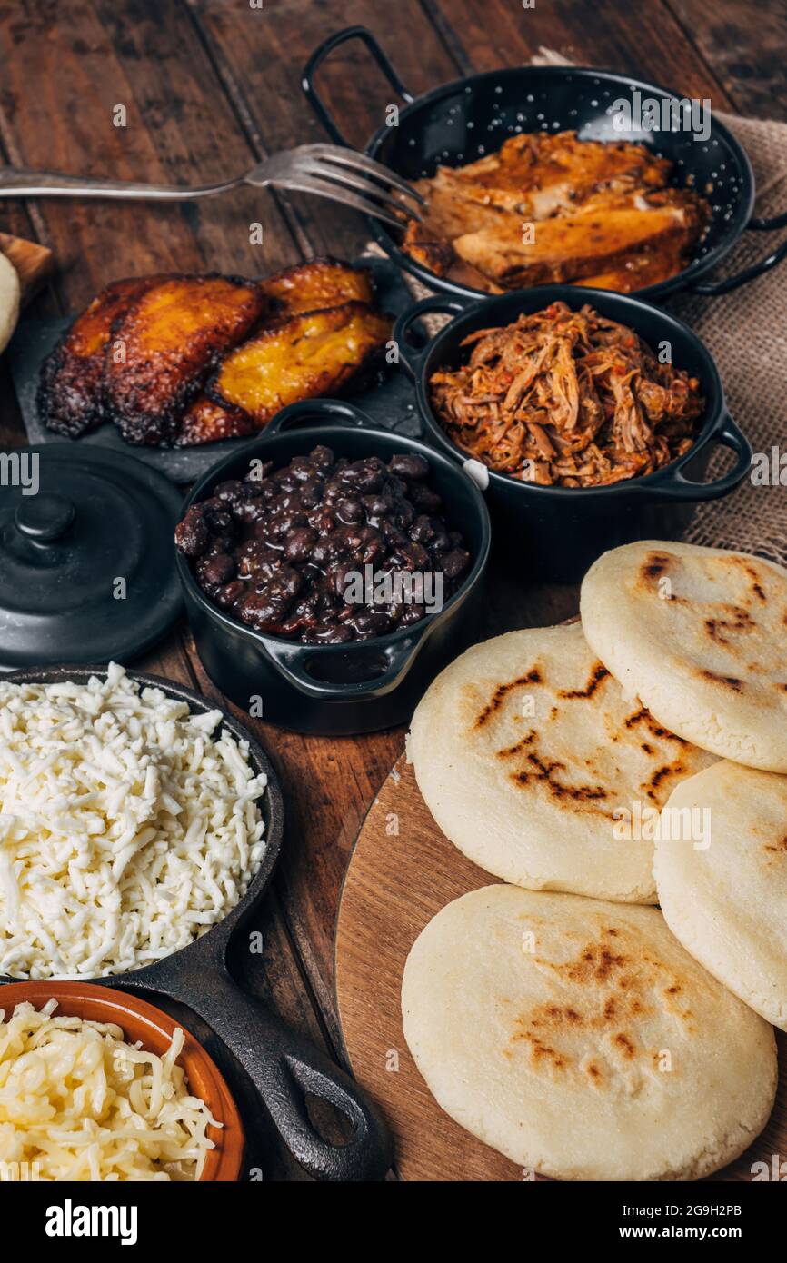 Table served with Venezuelan breakfast, arepas with different types of ...