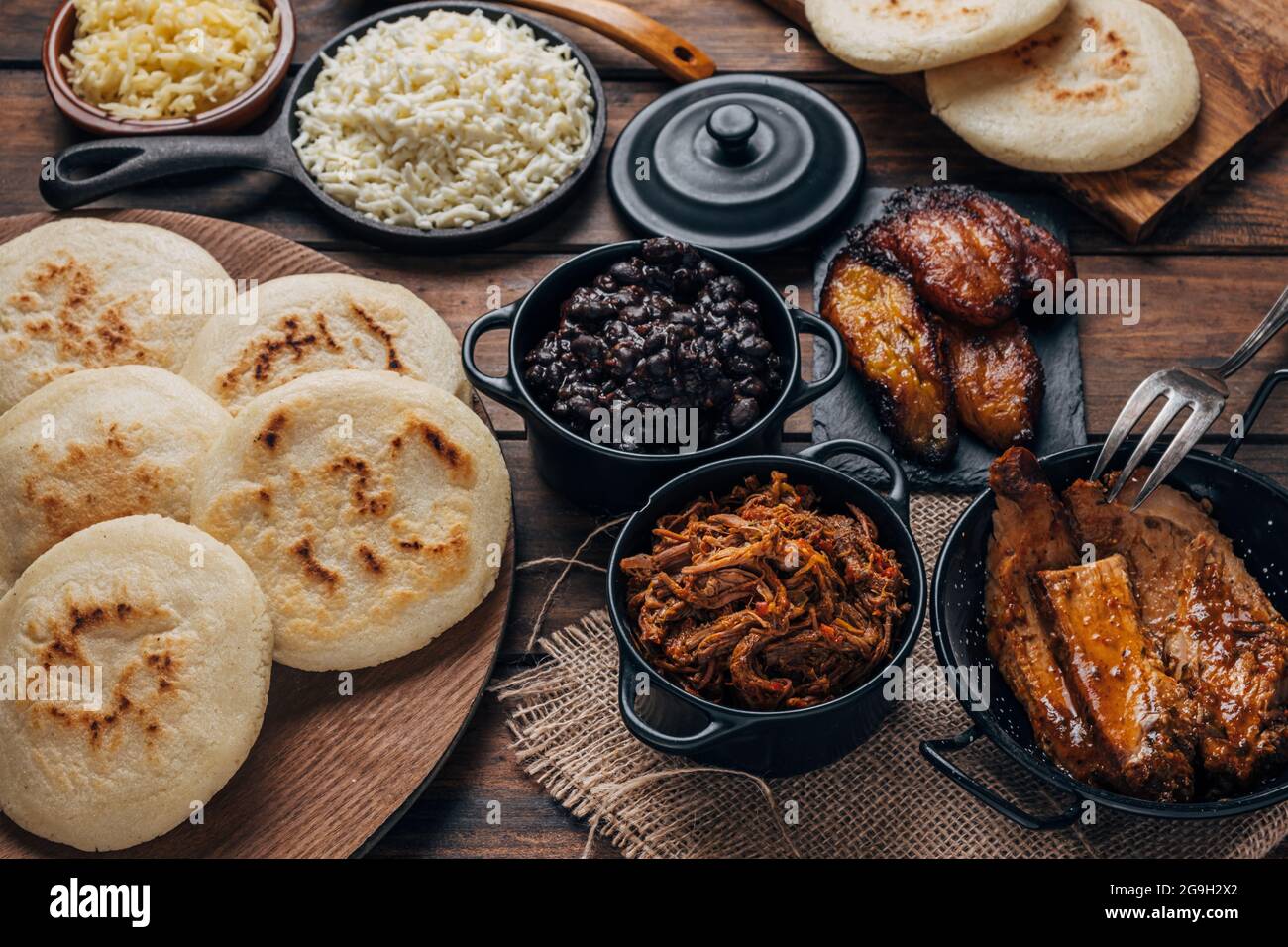 Table served with Venezuelan breakfast, arepas with different types of ...