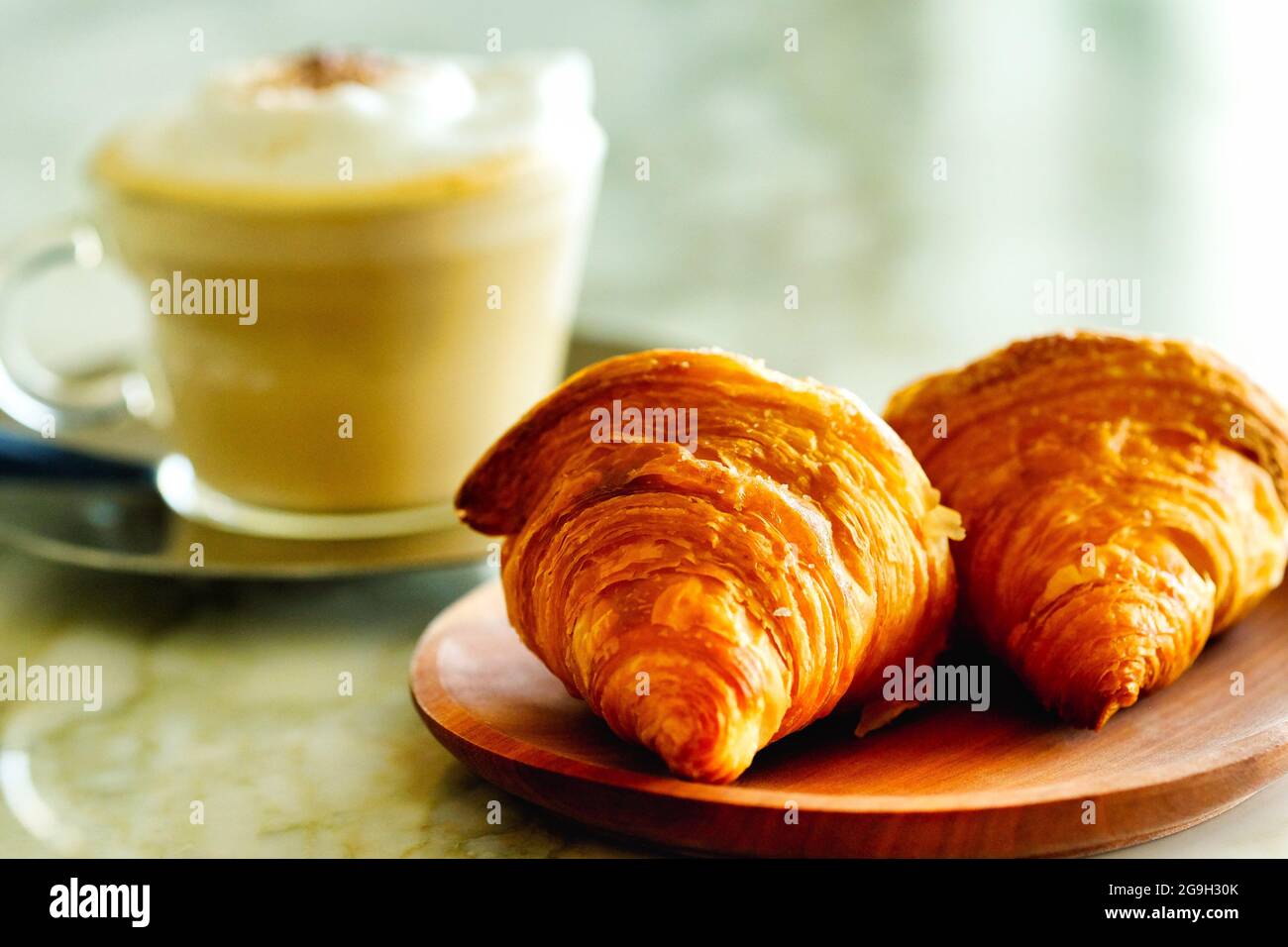 Cappuccino and croissant Stock Photo - Alamy