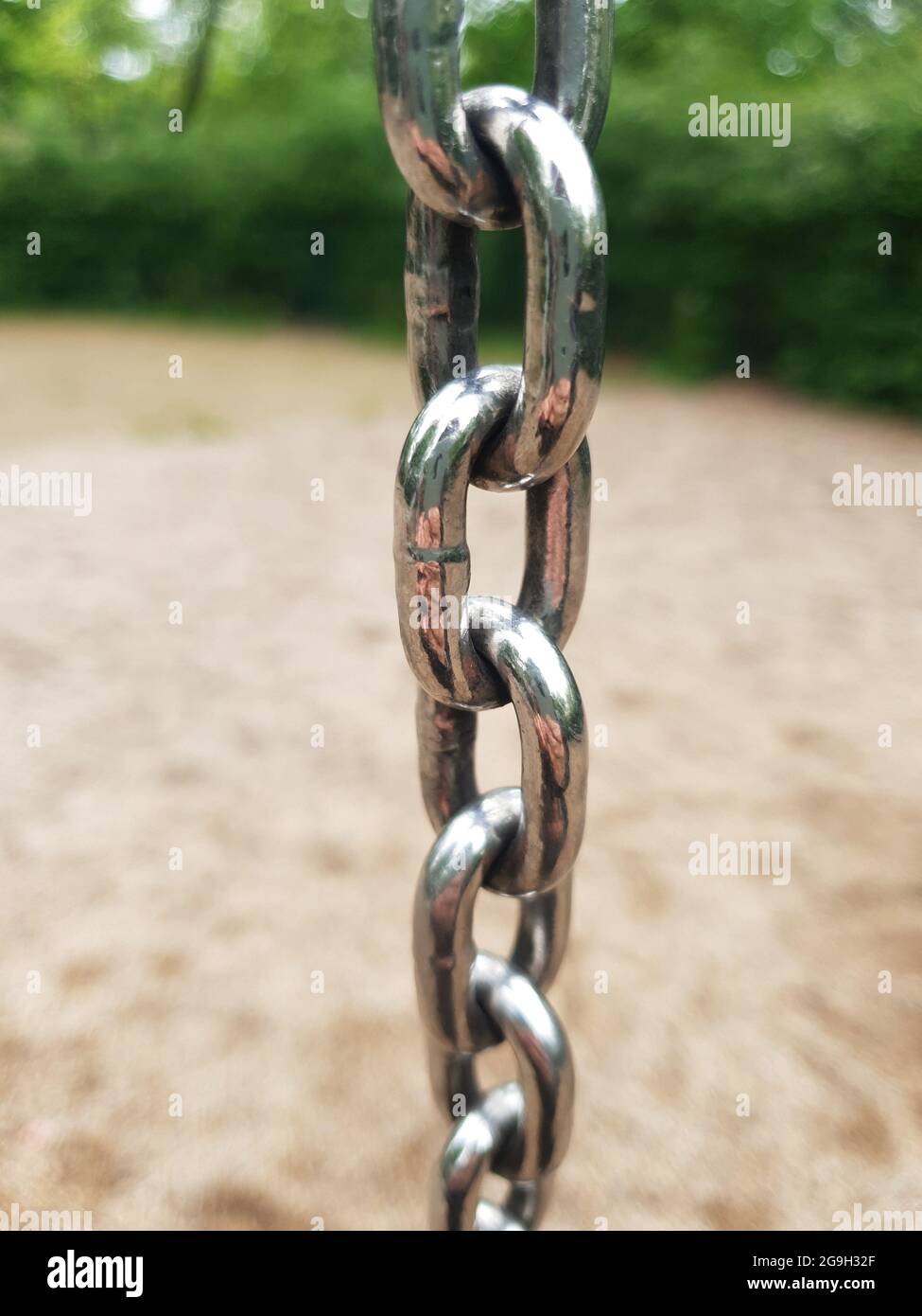 Closeup shot of a metallic chain of a swing in the park Stock Photo - Alamy