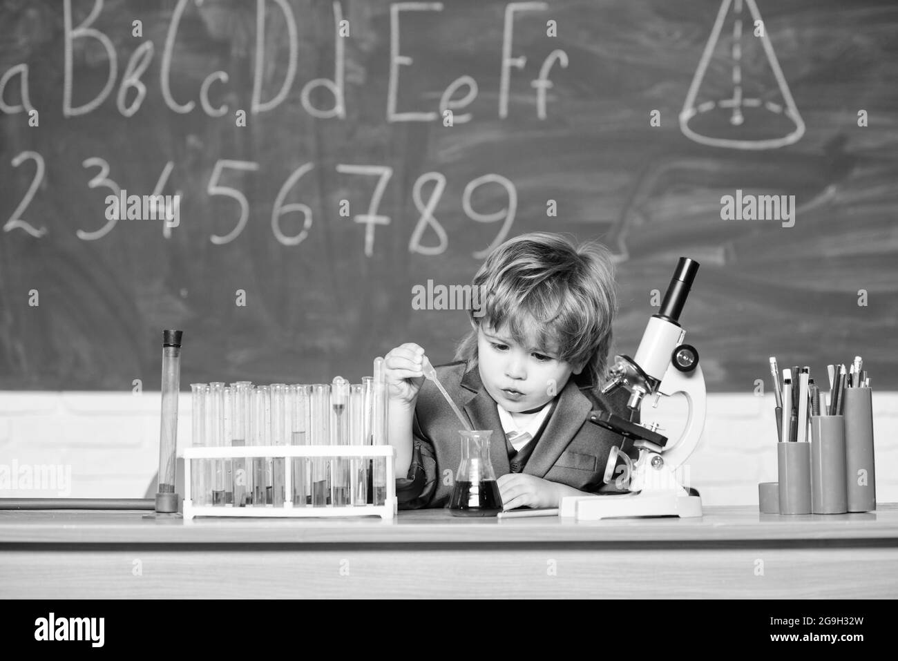 Technology and science concept. Kid study biology and chemistry in ...
