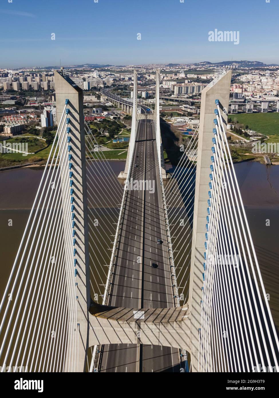 Vertical aerial view of Vasco da Gama suspended bridge, Tagus river ...