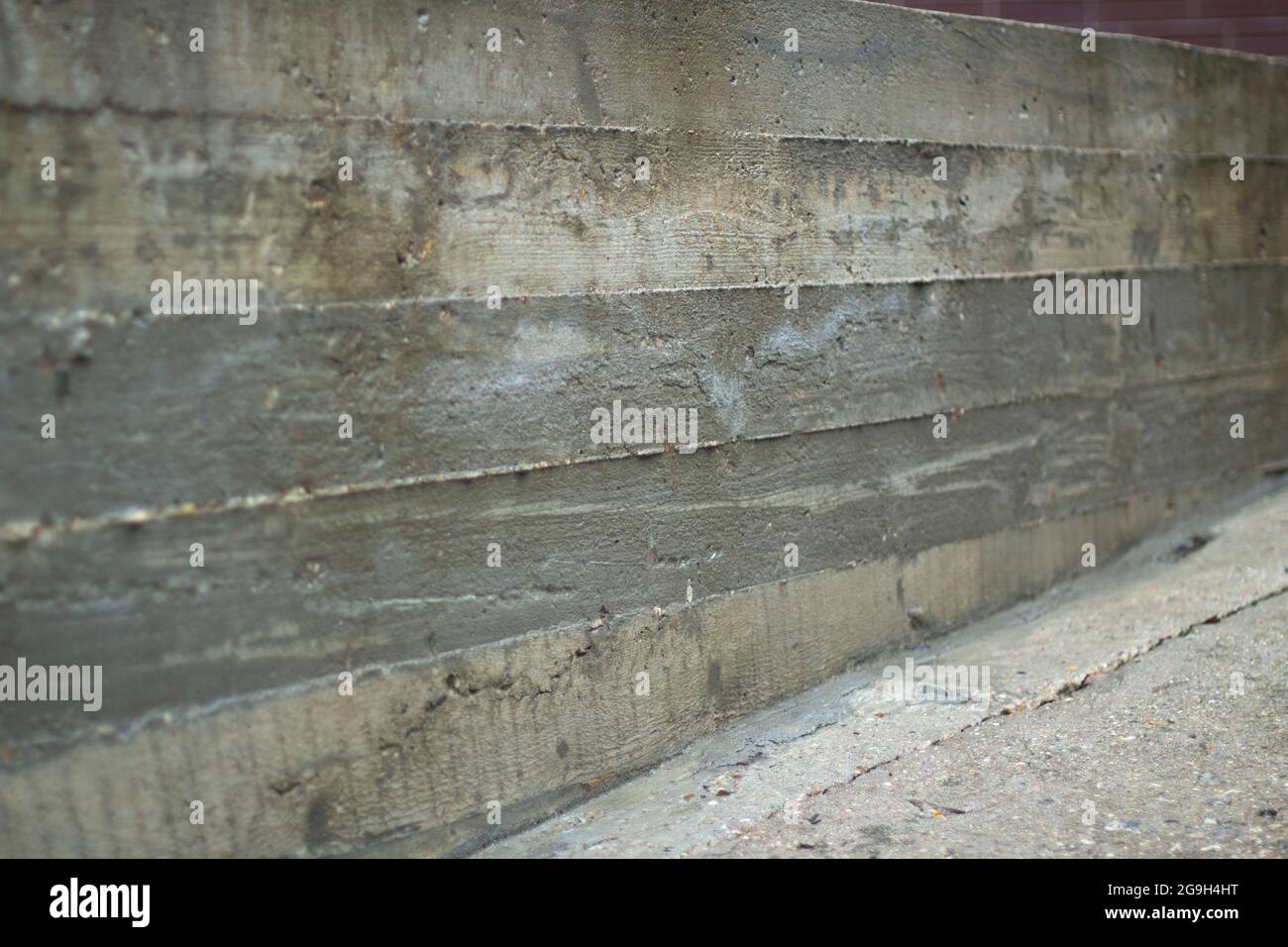 Untreated concrete. Cement wall. Unpolished facade of the building ...