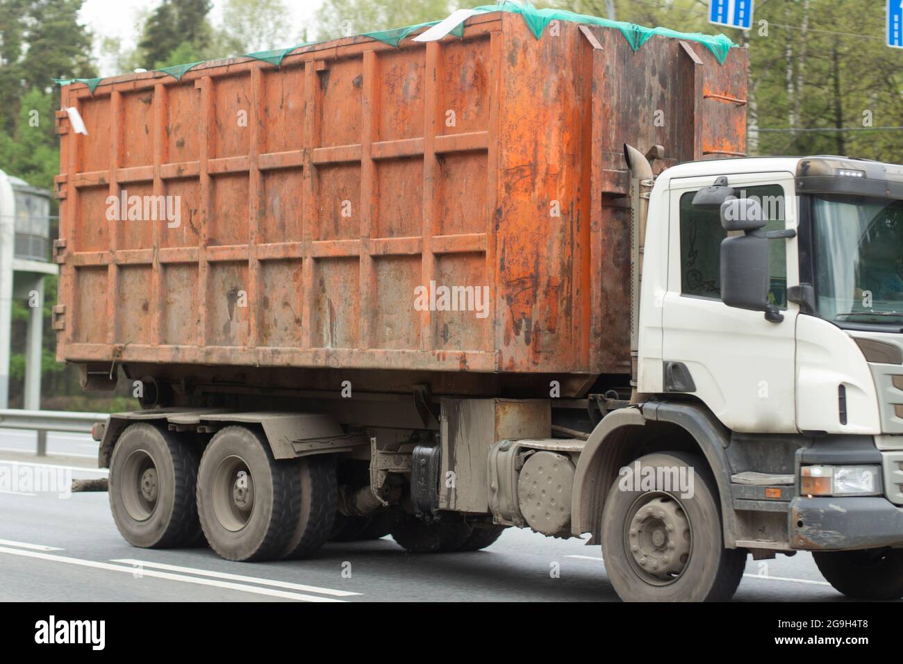 A garbage truck. Garbage removal in Russia. The truck is going to the ...
