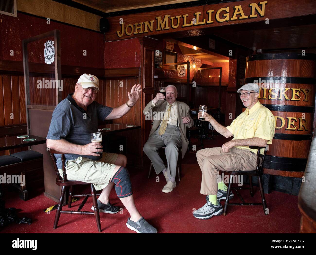 Peter Roche, from Finglas, Dublin, (centre) enjoys a pint with his ...