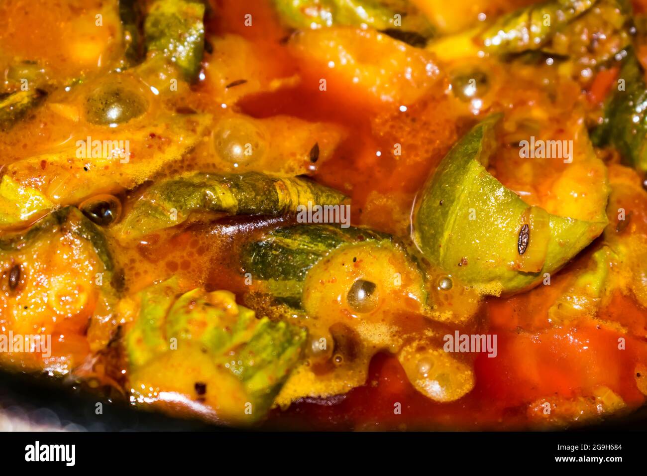 Indian red spicy curry made with potato & Coccinia in home Stock Photo ...