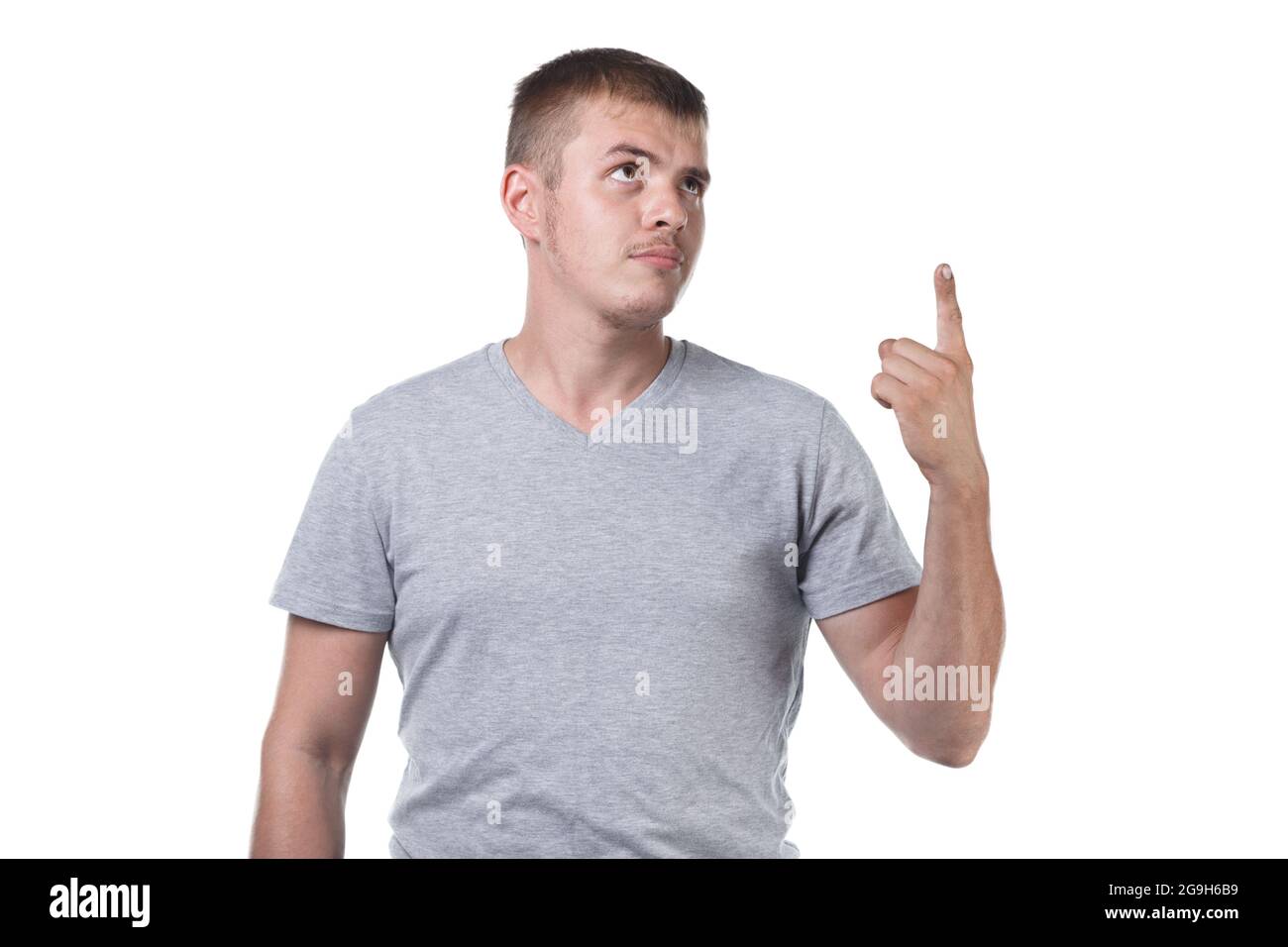 Image of young man with bristle showing forefinger up Stock Photo - Alamy