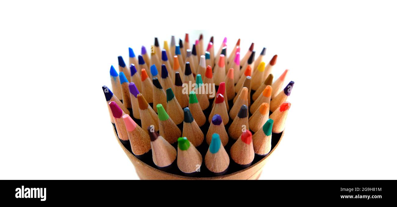 Large pile amount of colored pencils in a tube holder for art and ...
